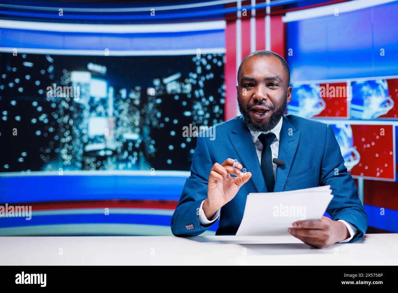 Talk show host addressing news on live transmission for global ...