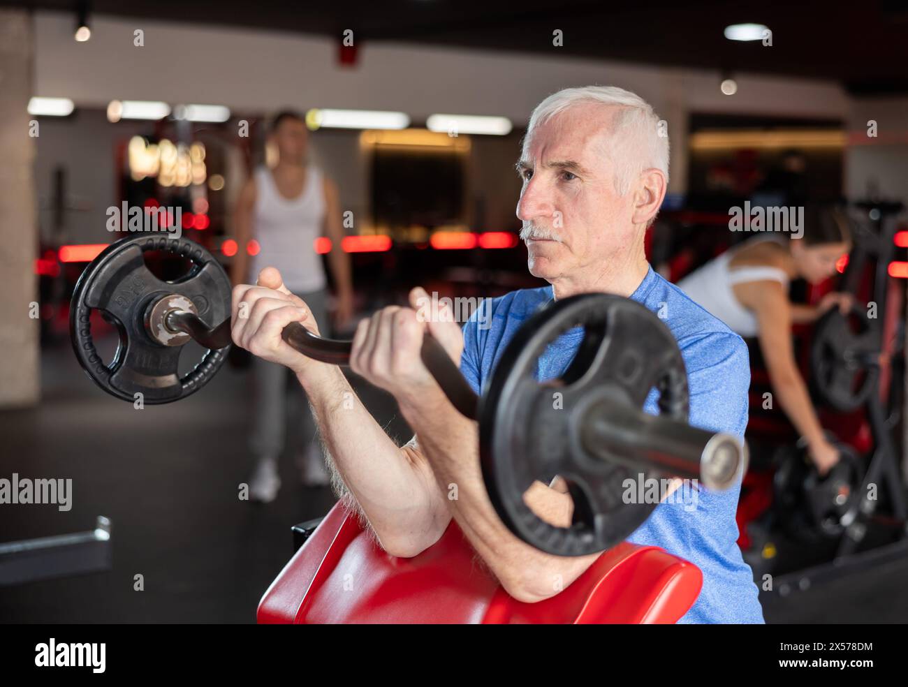 Active man during exercises to strengthen muscles of hands and body ...