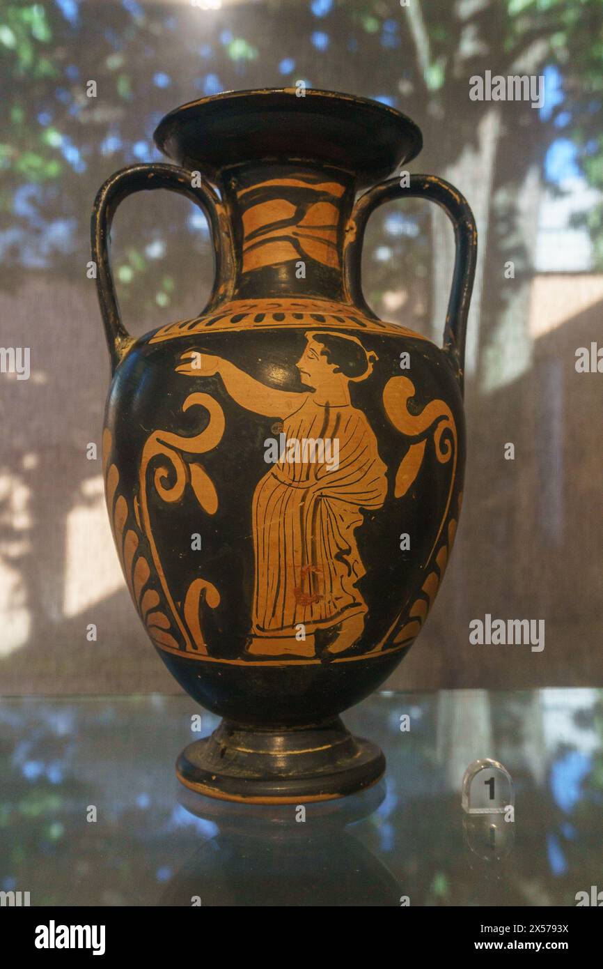 Ancient clay pot called Amphora, painted with black figures on a red ...
