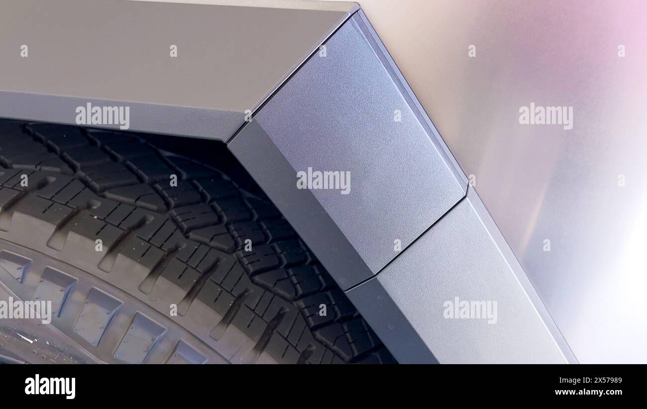 Detailed View of Tesla Cybertruck’s Angular Design and Textured Surface ...