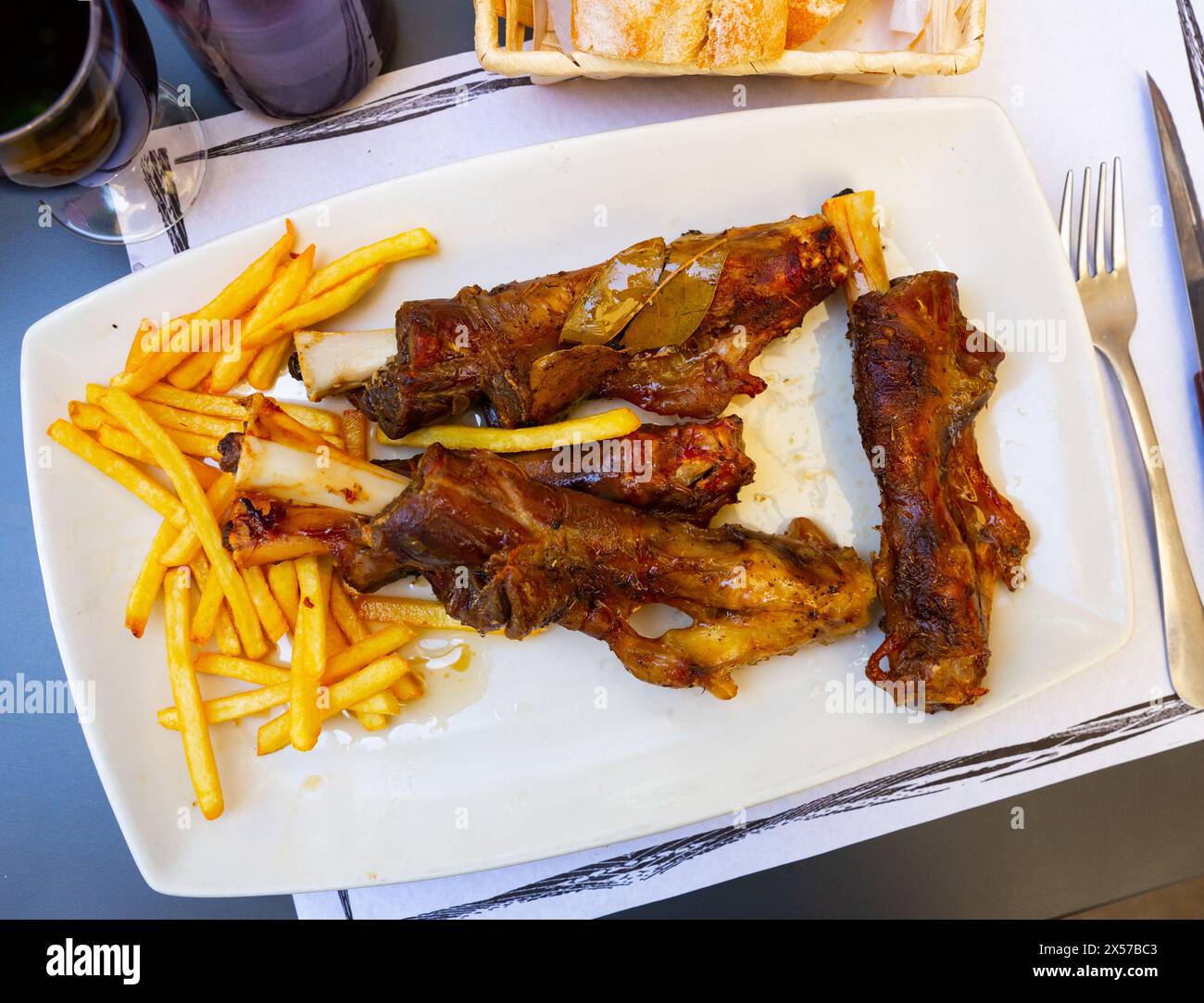 Baked lamb shins Stock Photo - Alamy