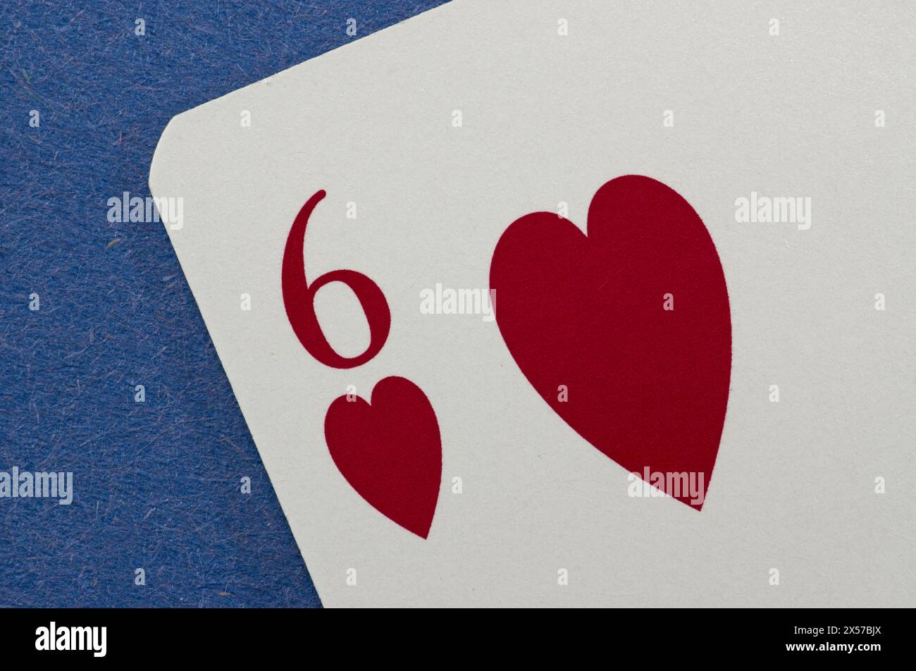 The Six of Hearts on a blue background Stock Photo - Alamy