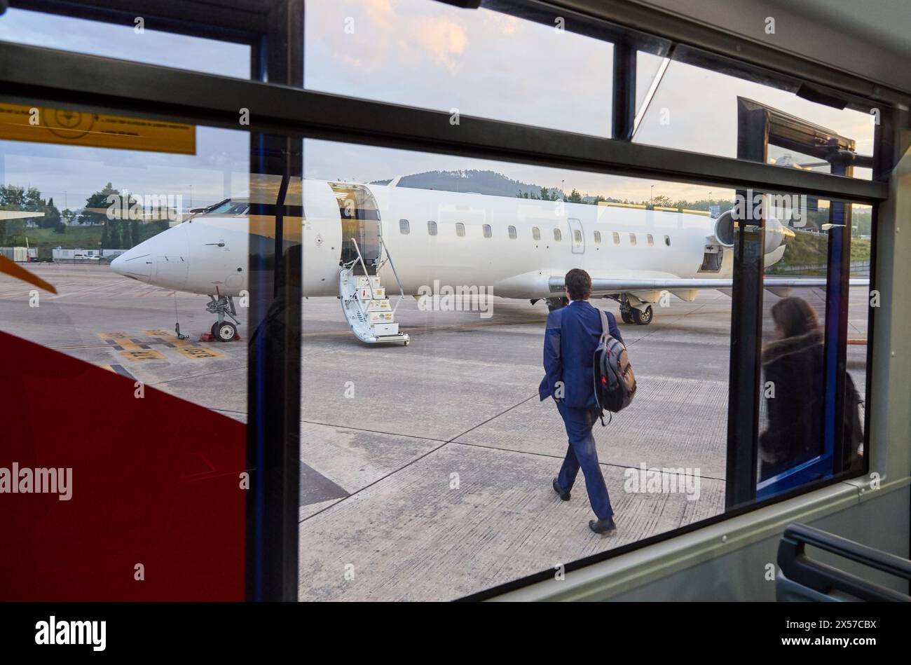 Passengers leaving the bus on the way to the plane, Bilbao Airport ...