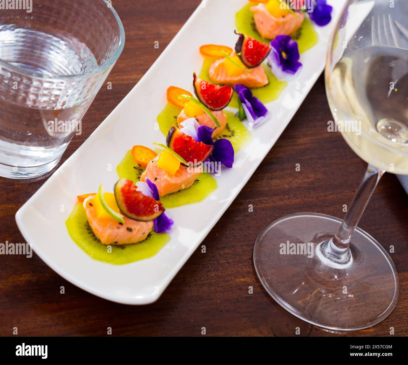 Delicious canapes with marinated salmon Stock Photo - Alamy