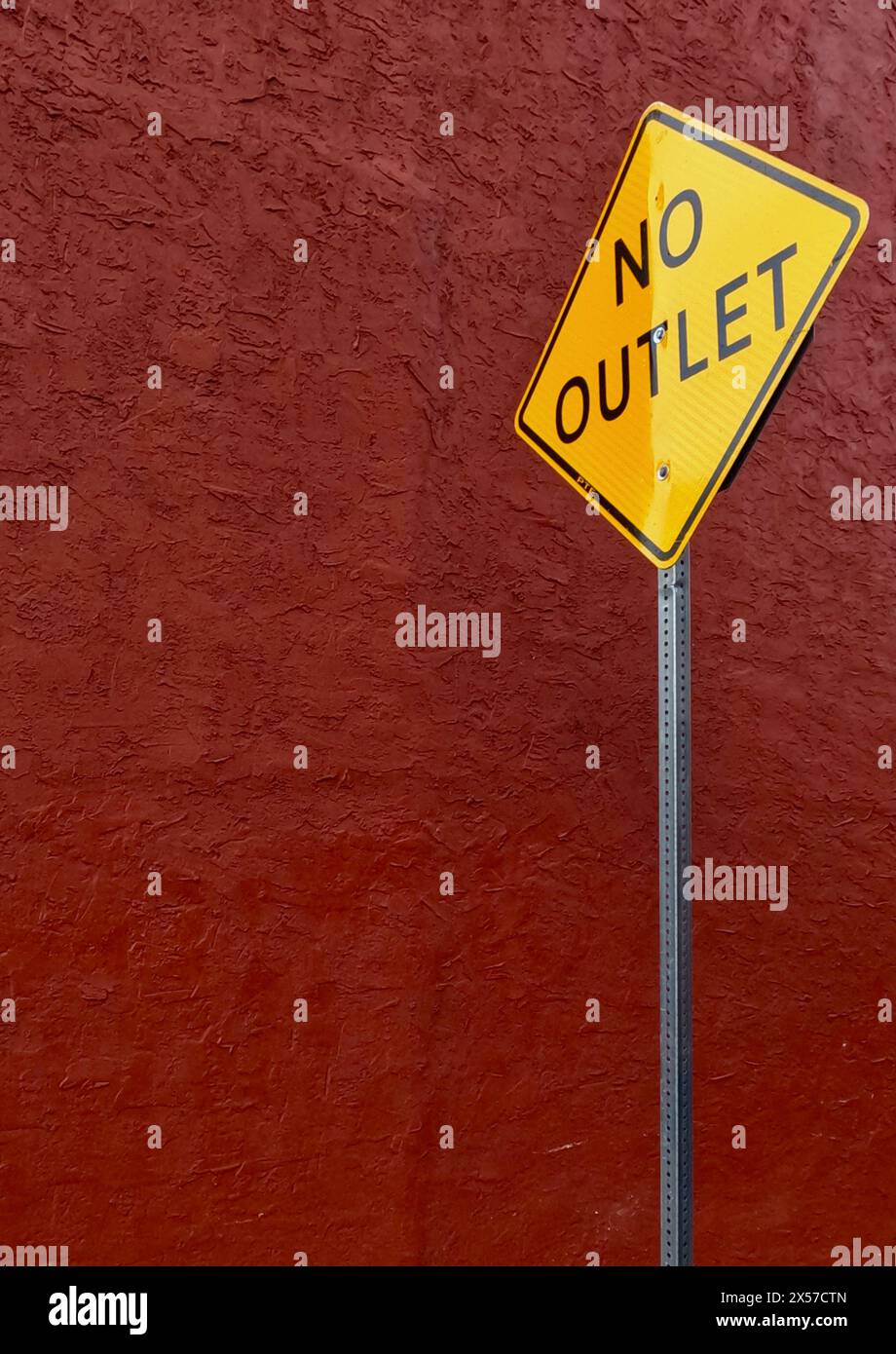 A No Outlet sign against a red background Stock Photo - Alamy