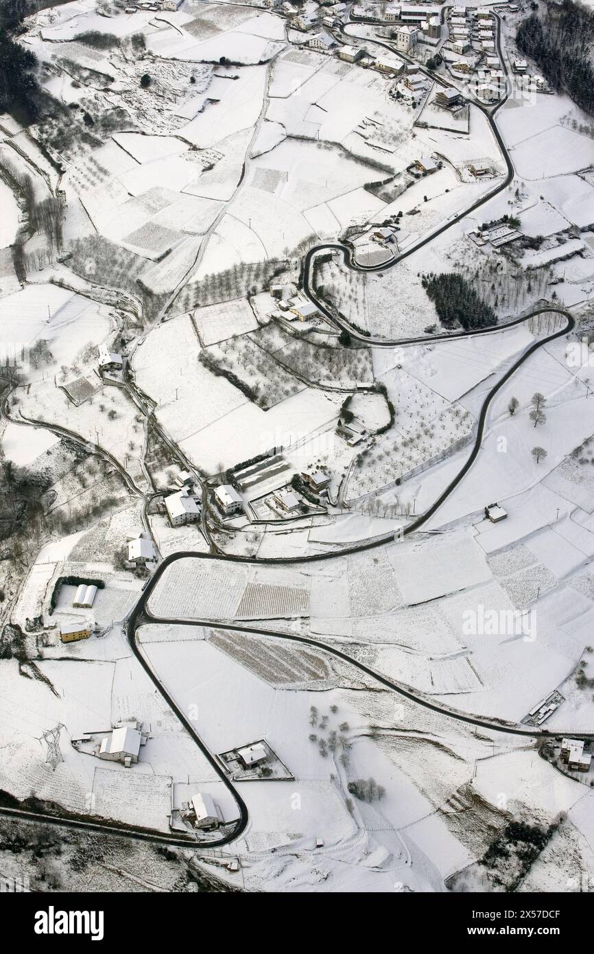 Snow-covered ´caseríos´ (typical country houses), Hernialde near Tolosa ...