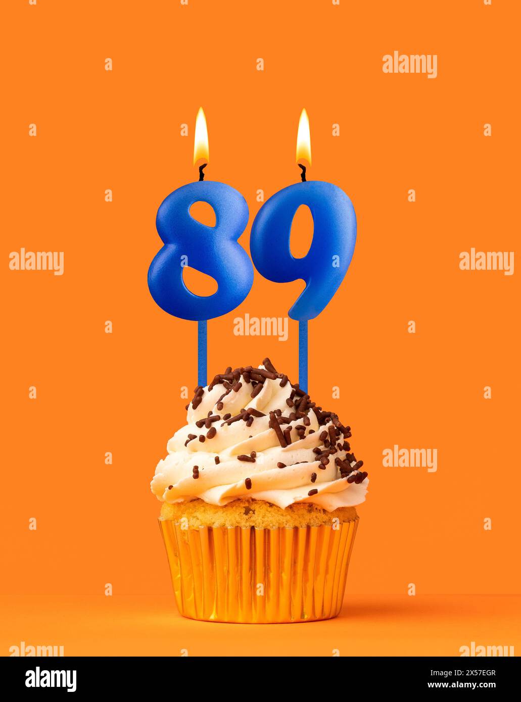 Blue candle number 89 - Birthday cupcake on orange background Stock ...
