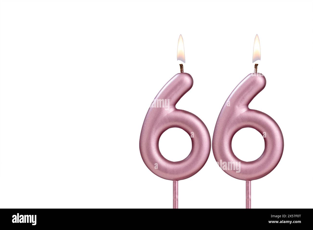 Lit birthday candle - Candle number 66 on white background Stock Photo ...