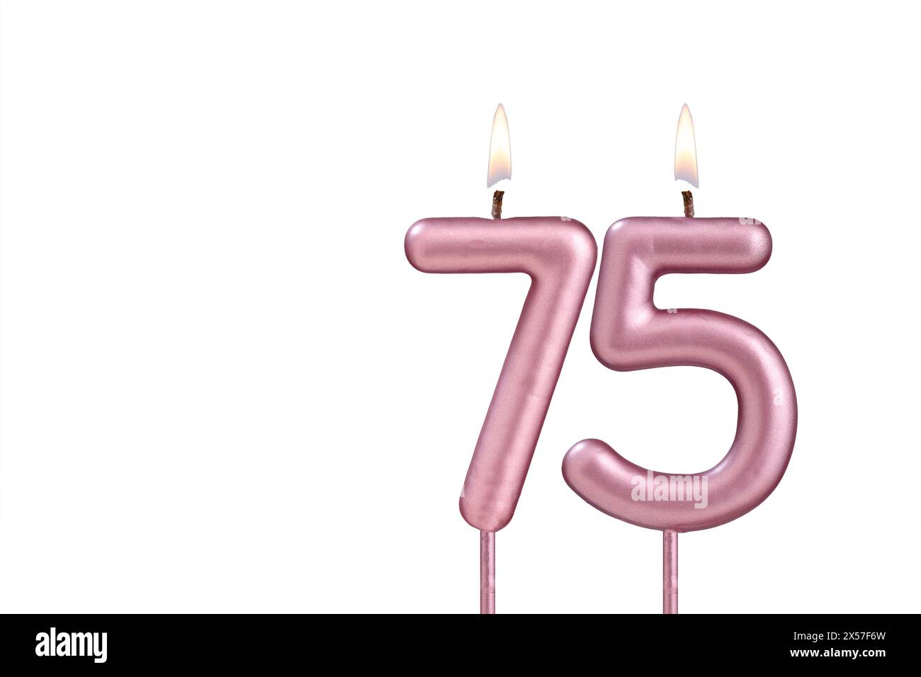 Candle number 75 - Lit birthday candle on white background Stock Photo ...