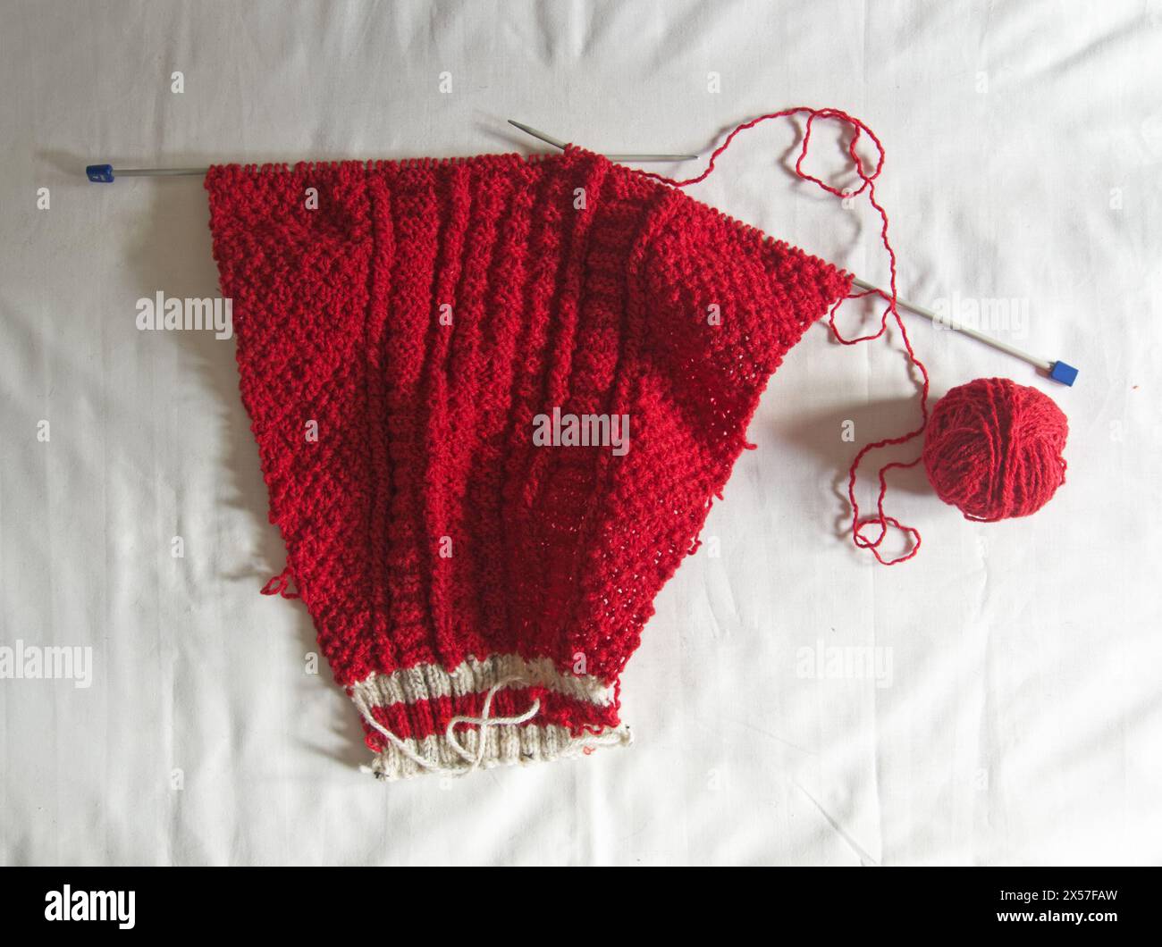 Piece of knitting using wool unravelled from an old garment Stock Photo ...