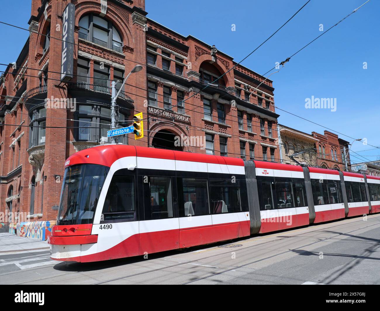 Modern Toronto streetcar in front of a historic 19th century hotel ...