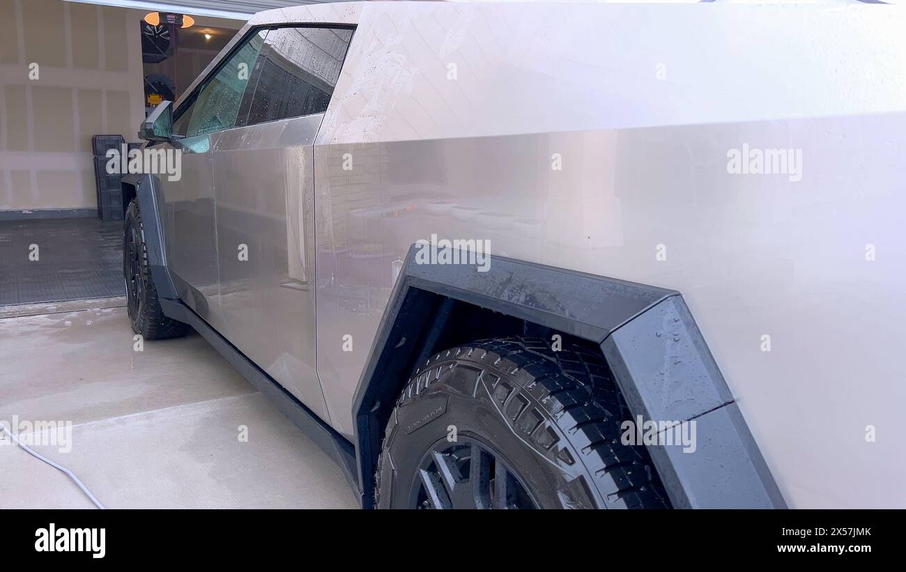 High-Pressure Cleaning of the Tesla Cybertruck Cargo Bed Stock Photo ...