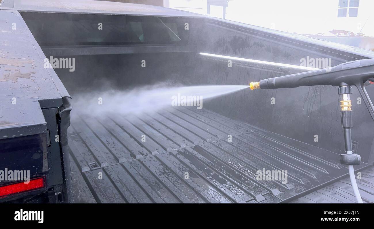 High-Pressure Cleaning of the Tesla Cybertruck Cargo Bed Stock Photo ...