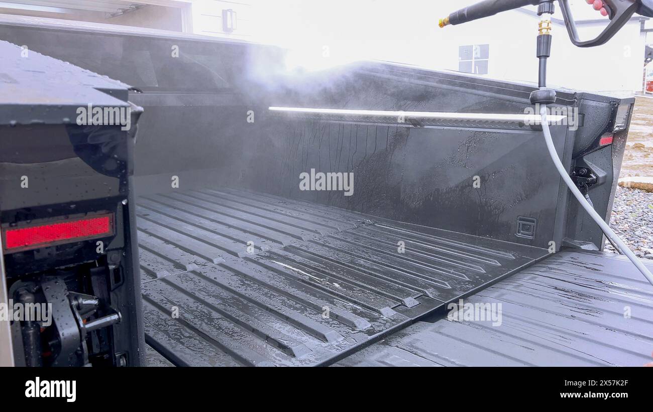 High-Pressure Cleaning of the Tesla Cybertruck Cargo Bed Stock Photo ...