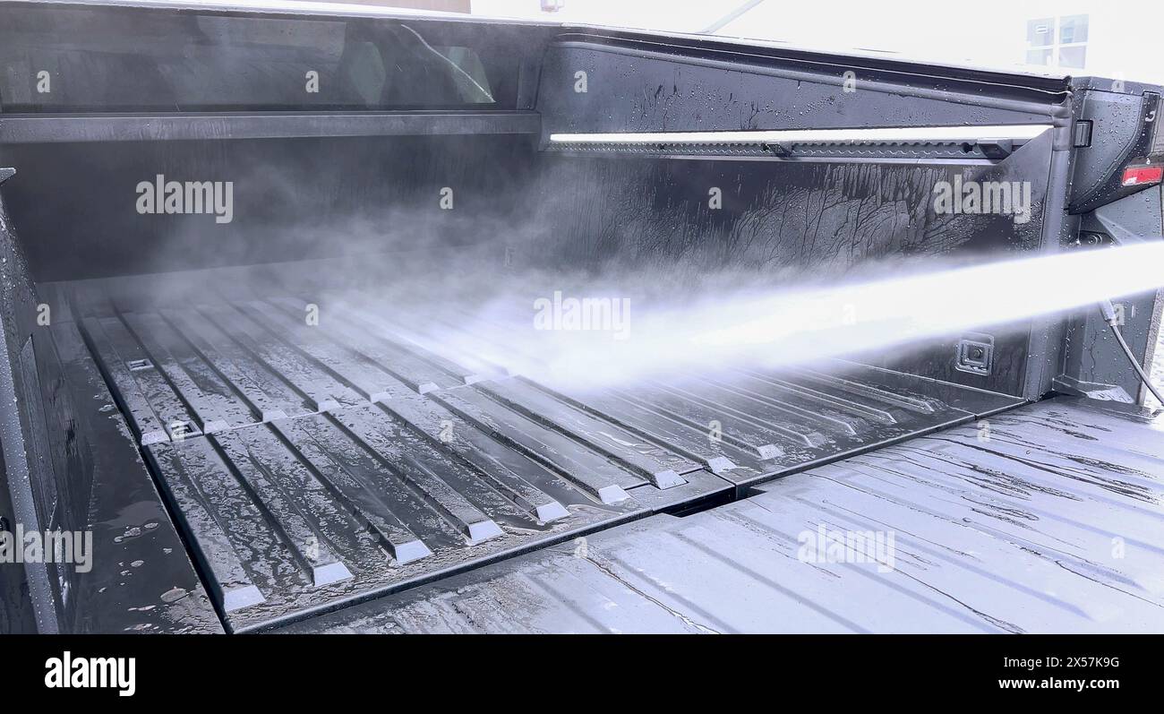 High-Pressure Cleaning of the Tesla Cybertruck Cargo Bed Stock Photo ...