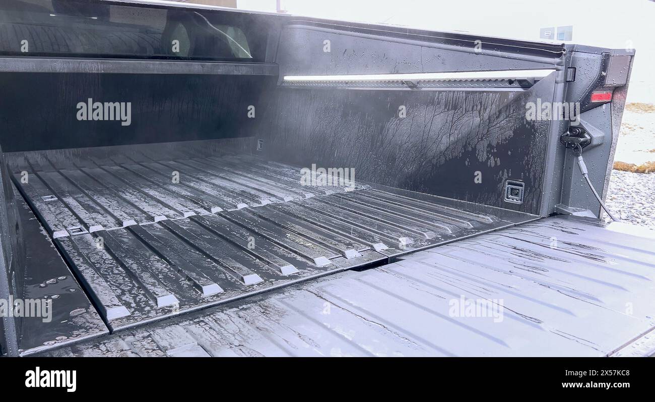 High-Pressure Cleaning of the Tesla Cybertruck Cargo Bed Stock Photo ...