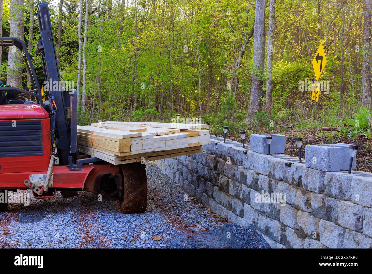 Using forklift, contractor delivers building materials on construction ...