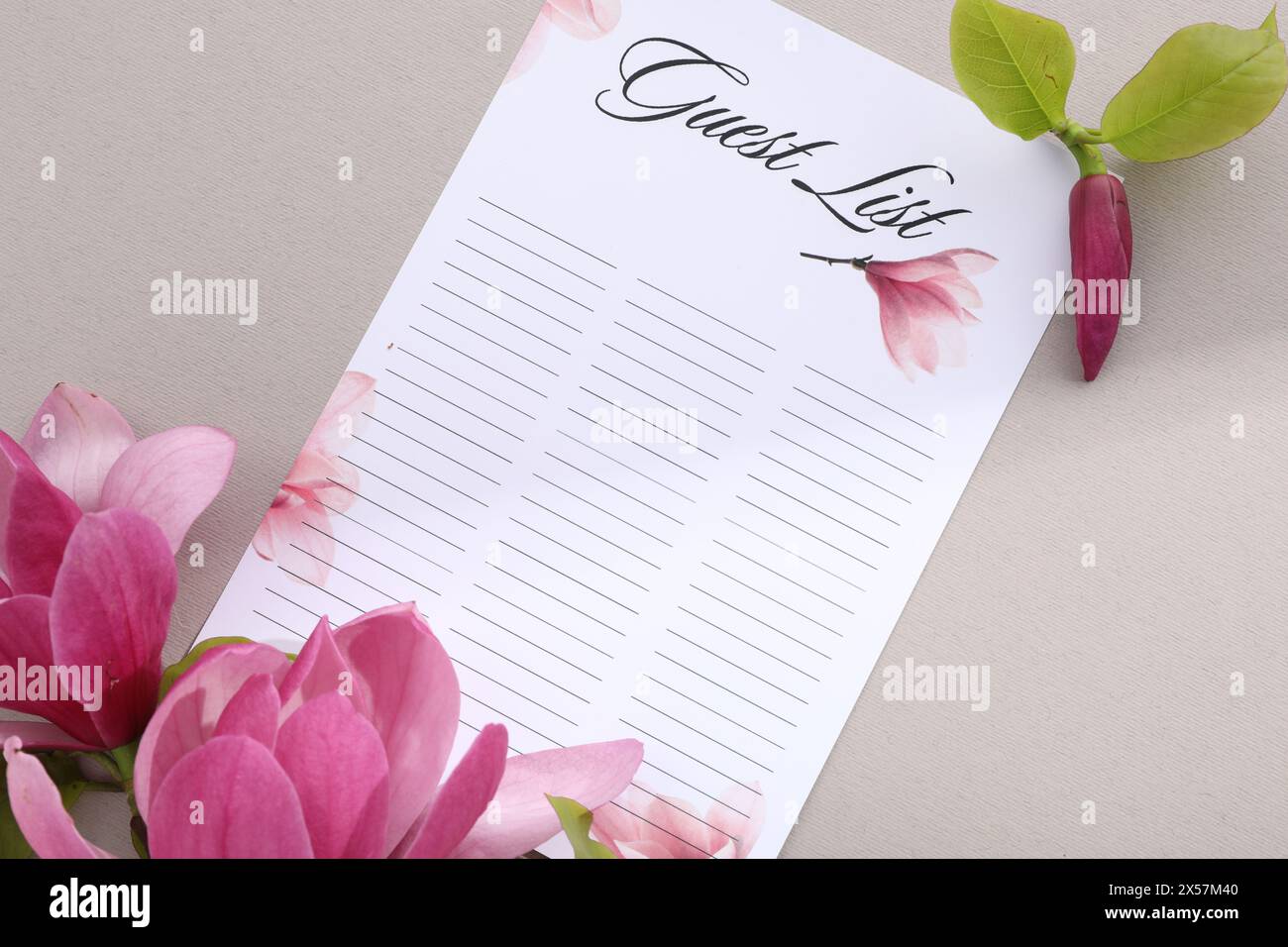 Guest list and beautiful flowers on grey background, flat lay. Space ...