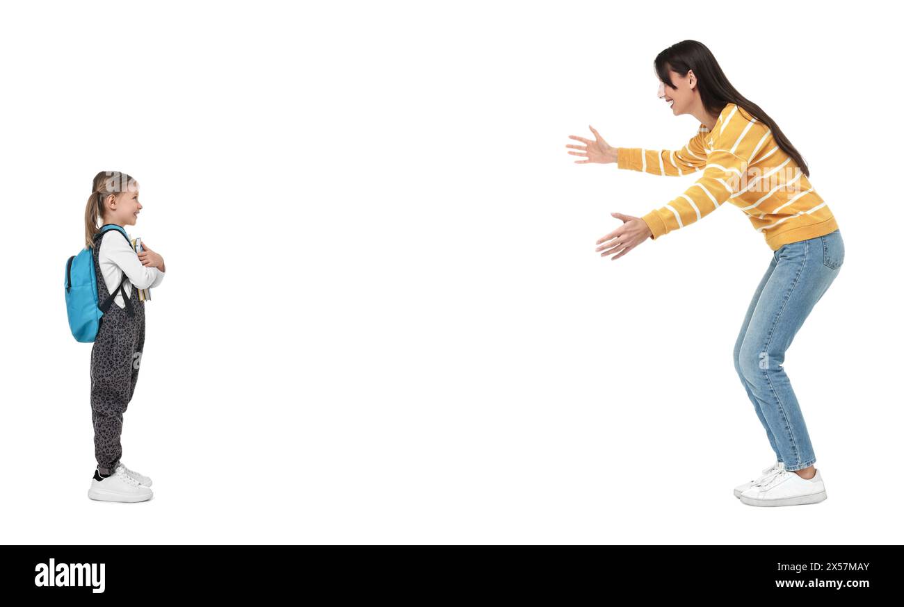 Mother reaching for her daughter on white background Stock Photo - Alamy