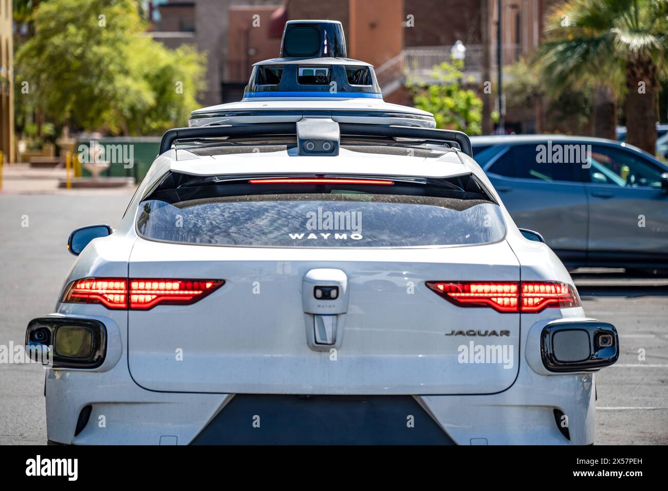 Phoenix, Arizona, USA - 3.23.2024: Behind a Waymo self-driving car ...