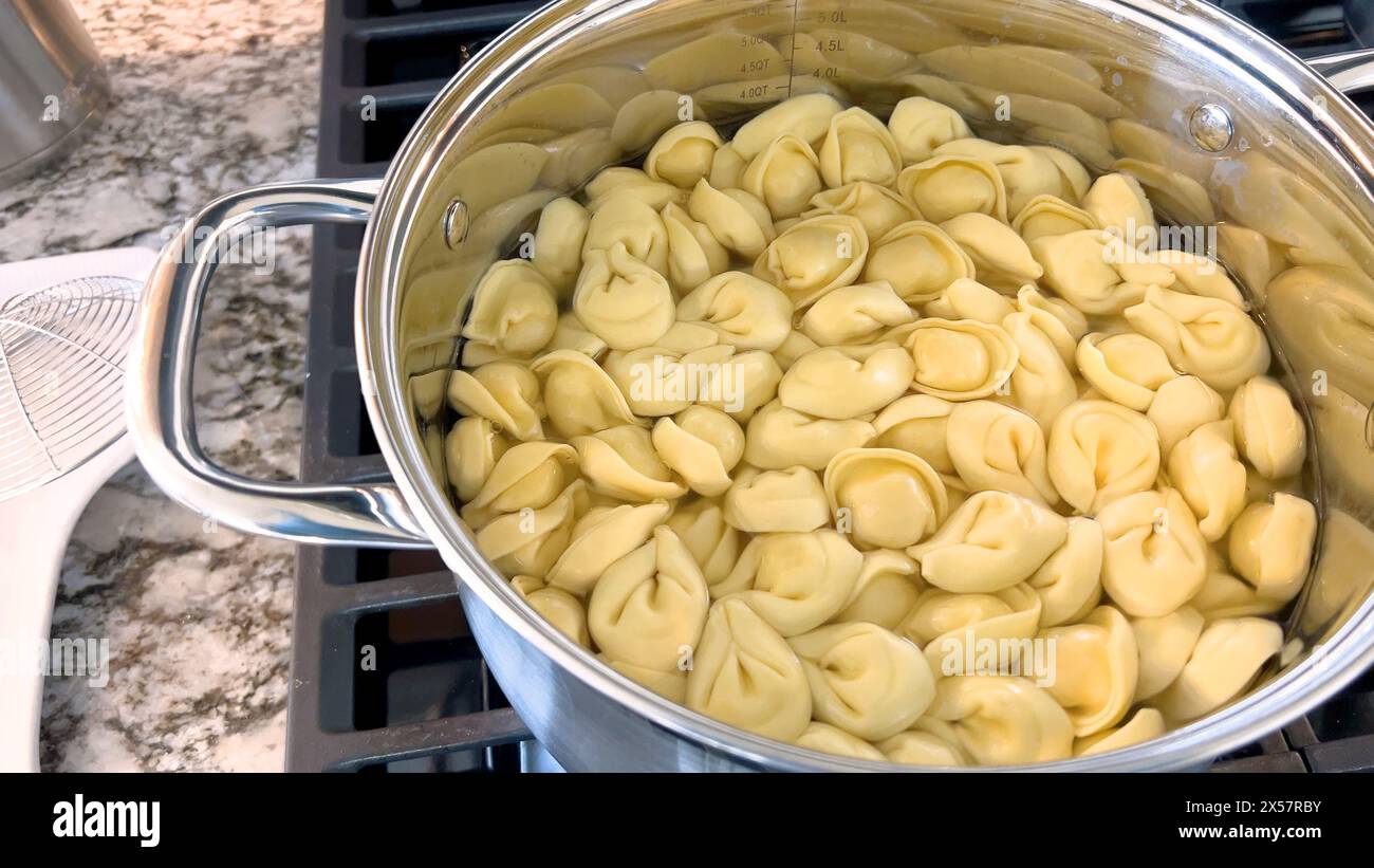 Boiling tortellini in stainless pot hi-res stock photography and images ...