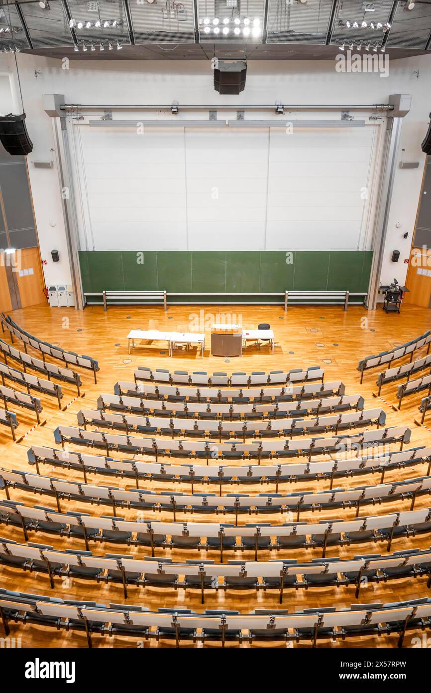 View from above into an empty lecture theatre with rows of seats and ...