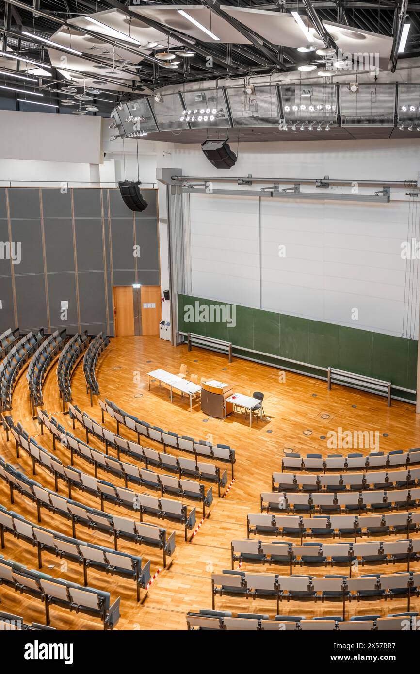 View from above into an empty lecture theatre with rows of seats and ...