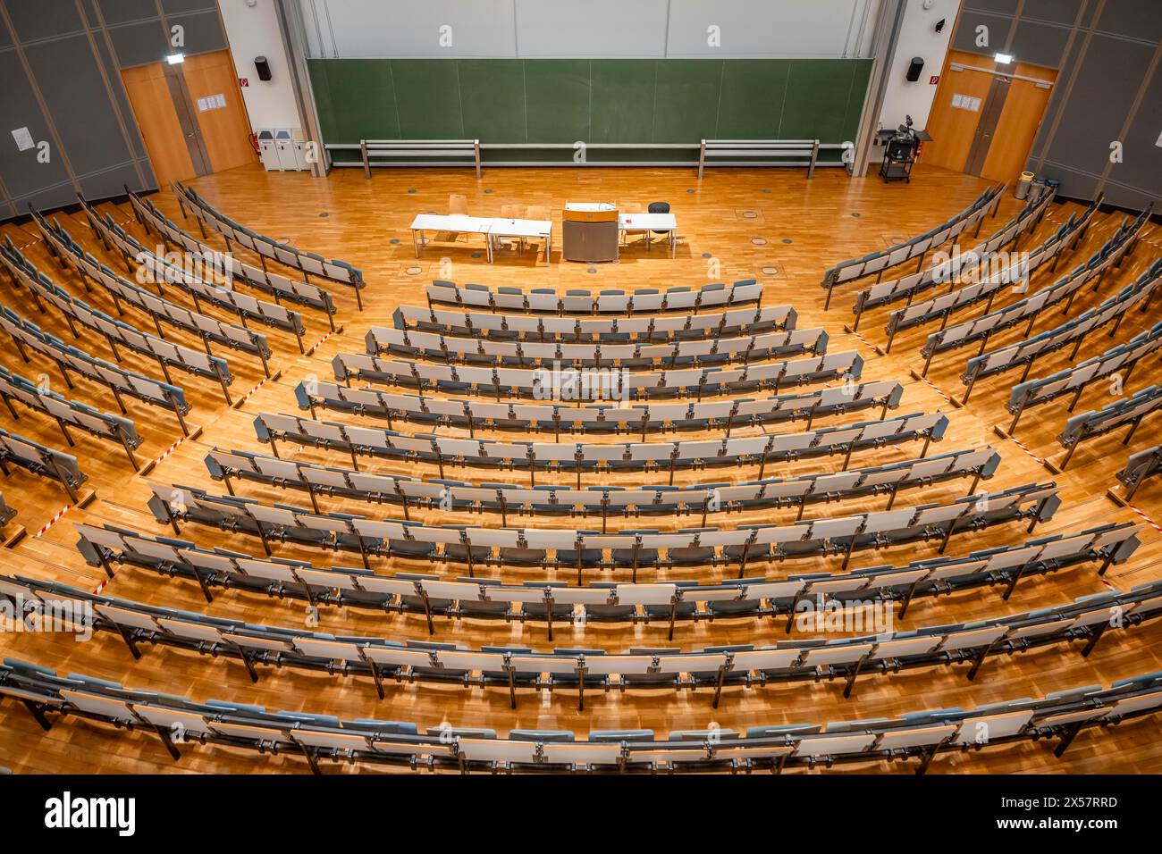 View from above into an empty lecture theatre with rows of seats and ...