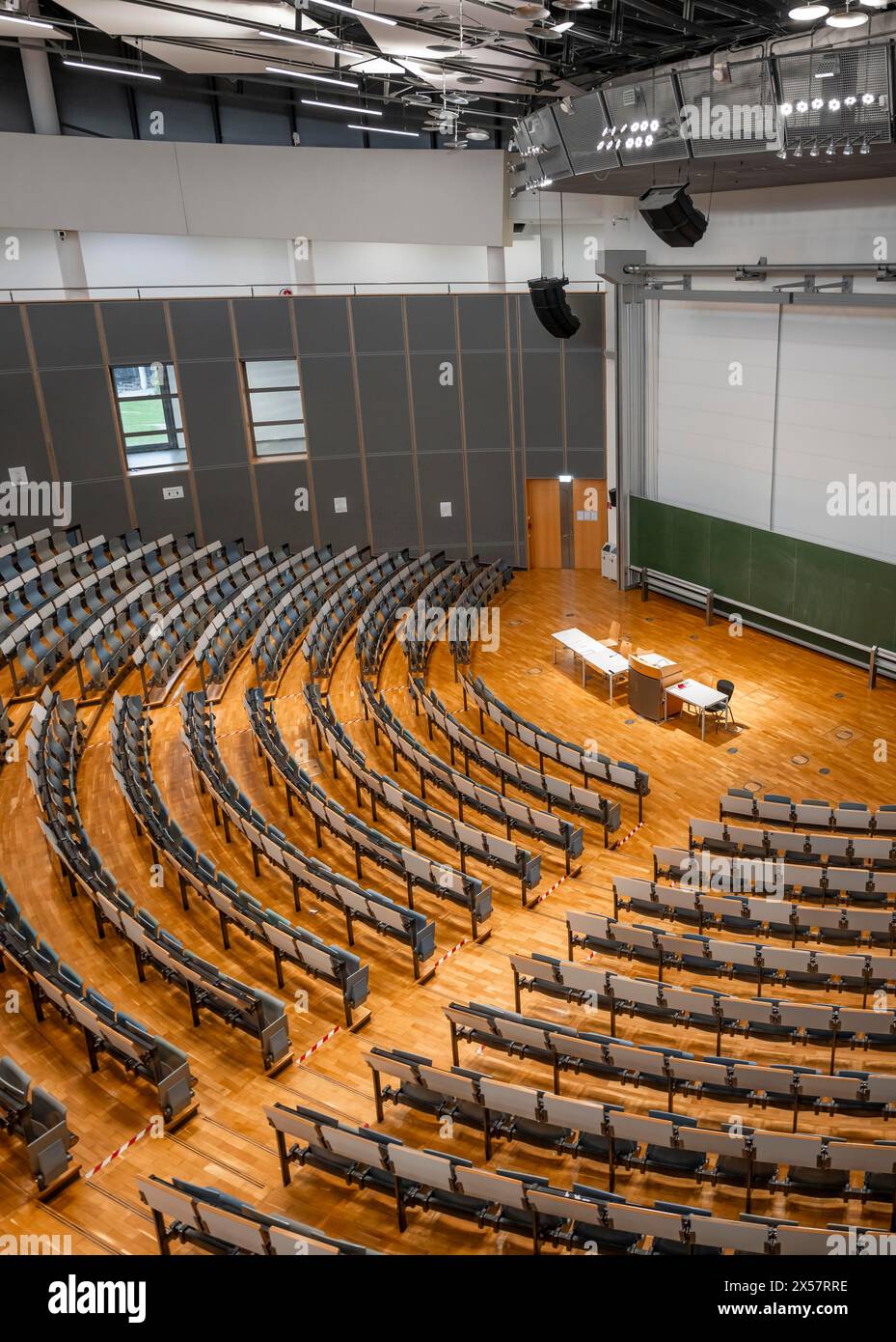 View from above into an empty lecture theatre with rows of seats and ...