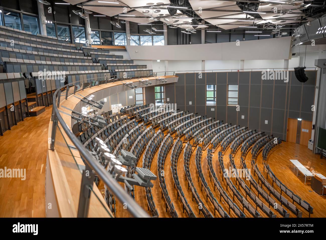 View from the gallery into an empty lecture theatre with rows of seats ...