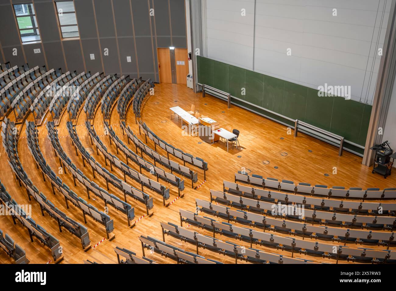 View from above into an empty lecture theatre with rows of seats and ...