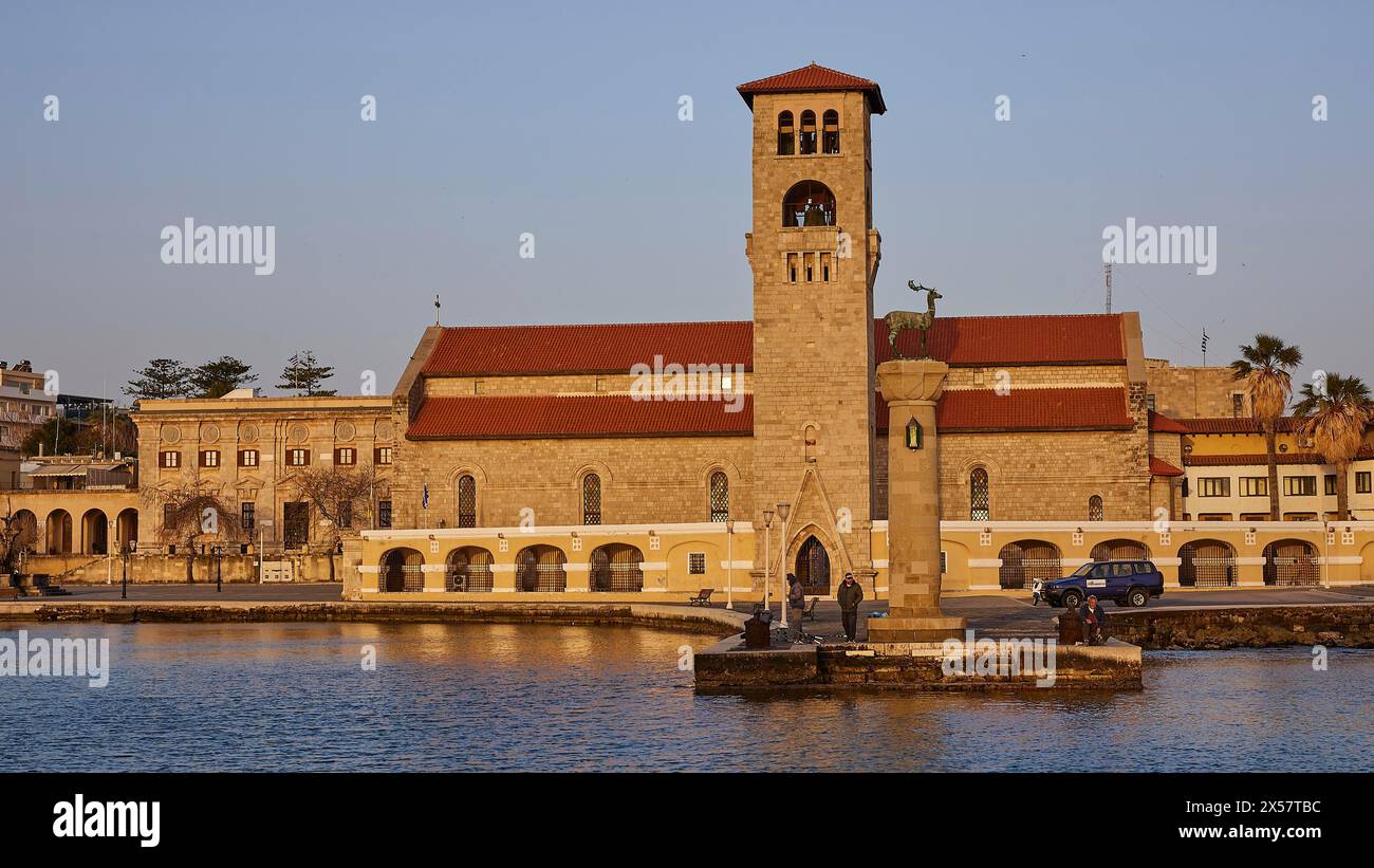 Reflection of a church in calm water under the golden sky of the ...