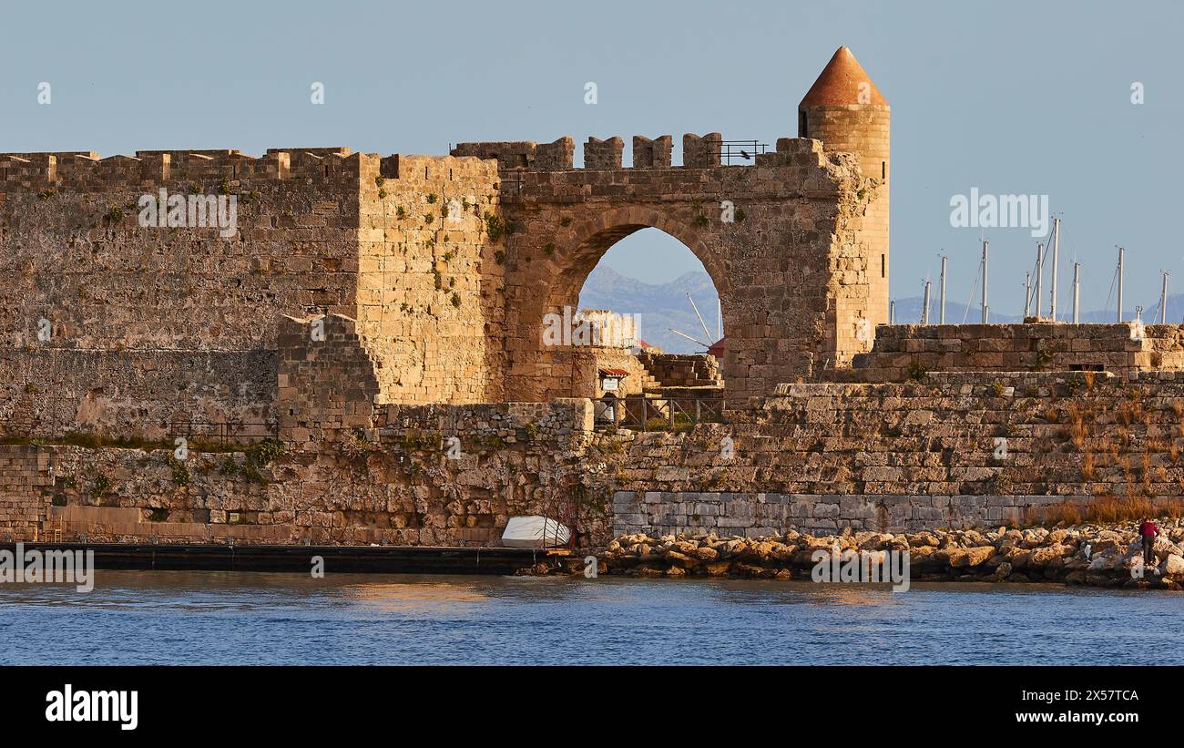 Medieval tower with arch over water with boats, De Naillac Tower ...