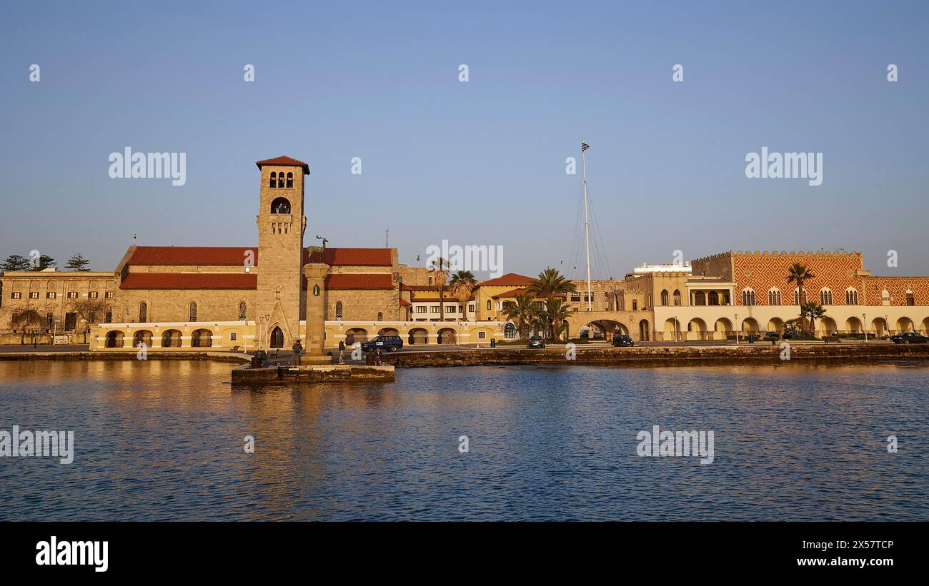 Church at the harbour, surrounded by calm sea and clear blue sky at ...