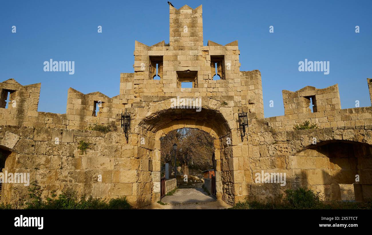 Ancient stone ruins of an arch under a clear blue sky, Tor tor of St ...