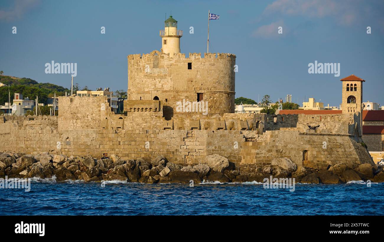 Stone fortress with lighthouse by the sea under a blue sky, Fort of ...