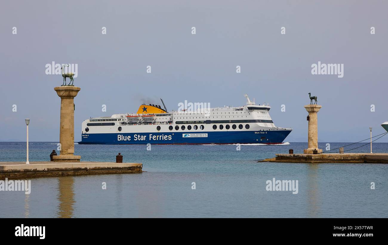 Ferry boat sailing between columns with statues on blue sea, Deer ...
