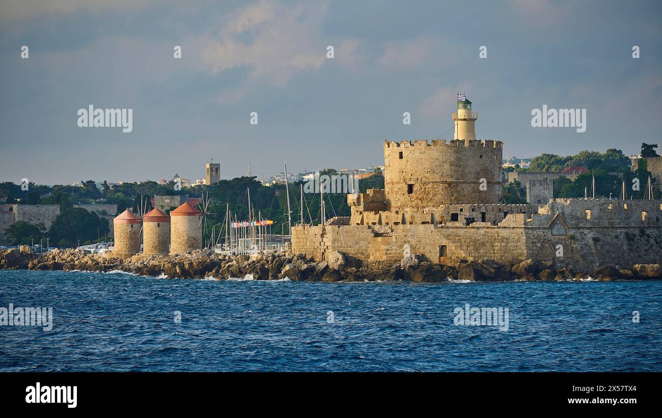 Historic fortress with lighthouse on the coast under a cloudy sky, Fort ...