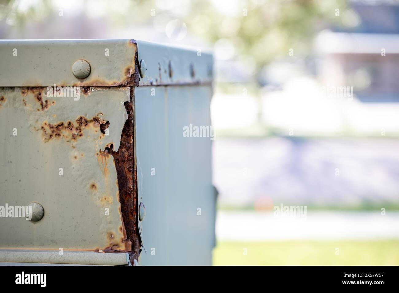 Rusted and peeling paint on an electrical transformer exposed to the ...