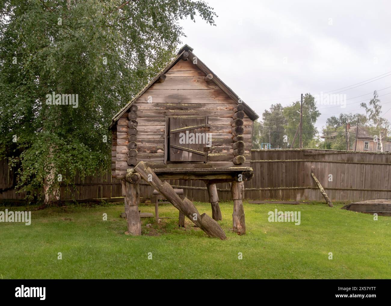 A traditional warehouse made of wood standing on four logs for grain ...