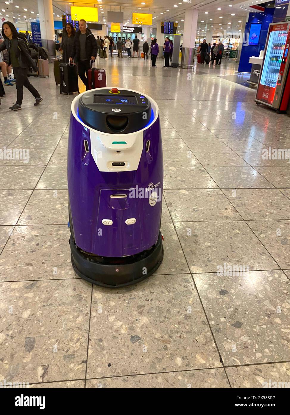 AI purple robots seen in terminal 2 cleaning the floors .They operate ...