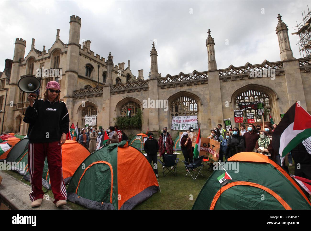 A protester with a megaphone readies students and their supporters for ...