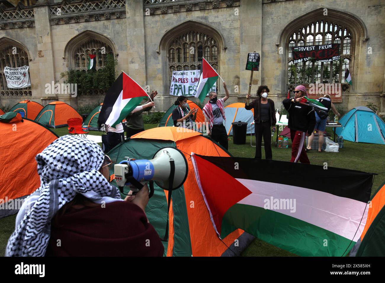 A protester with a megaphone chants for a free Palestine with students ...