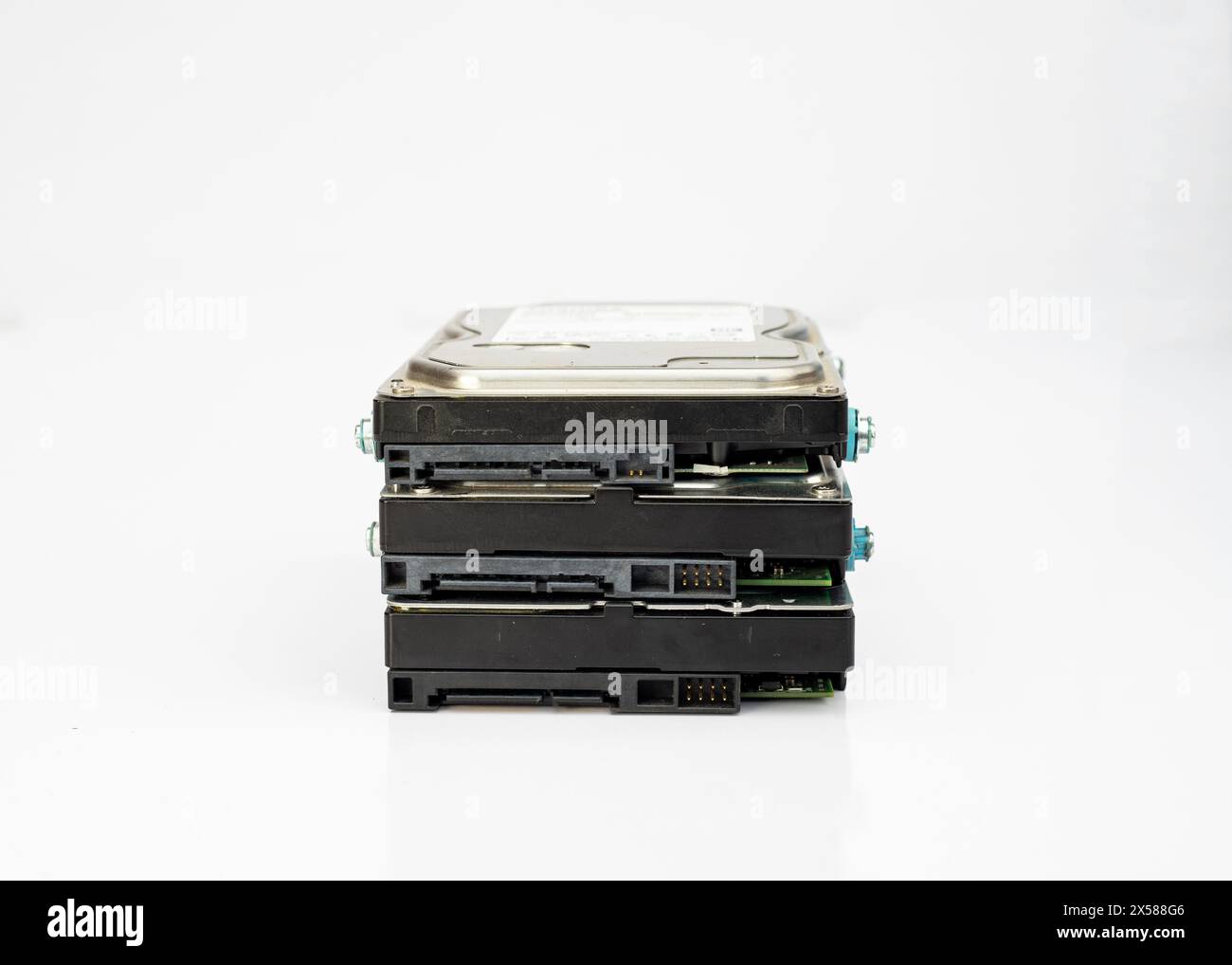 Stack of computer internal 3.5 inch hard disk drives on isolated white ...