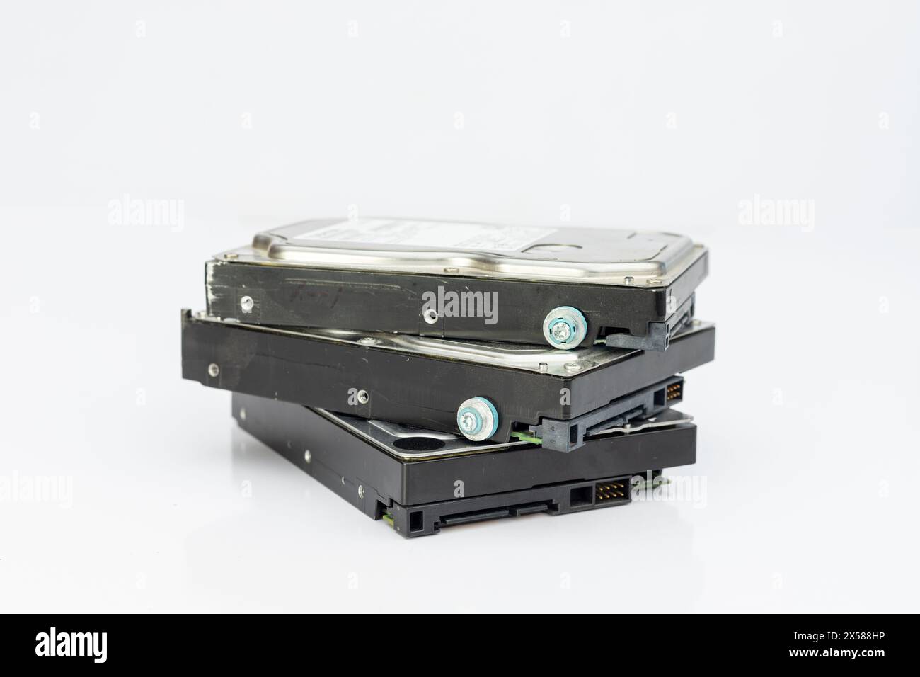 Computer hard disk drives stacked isolated on white background with ...