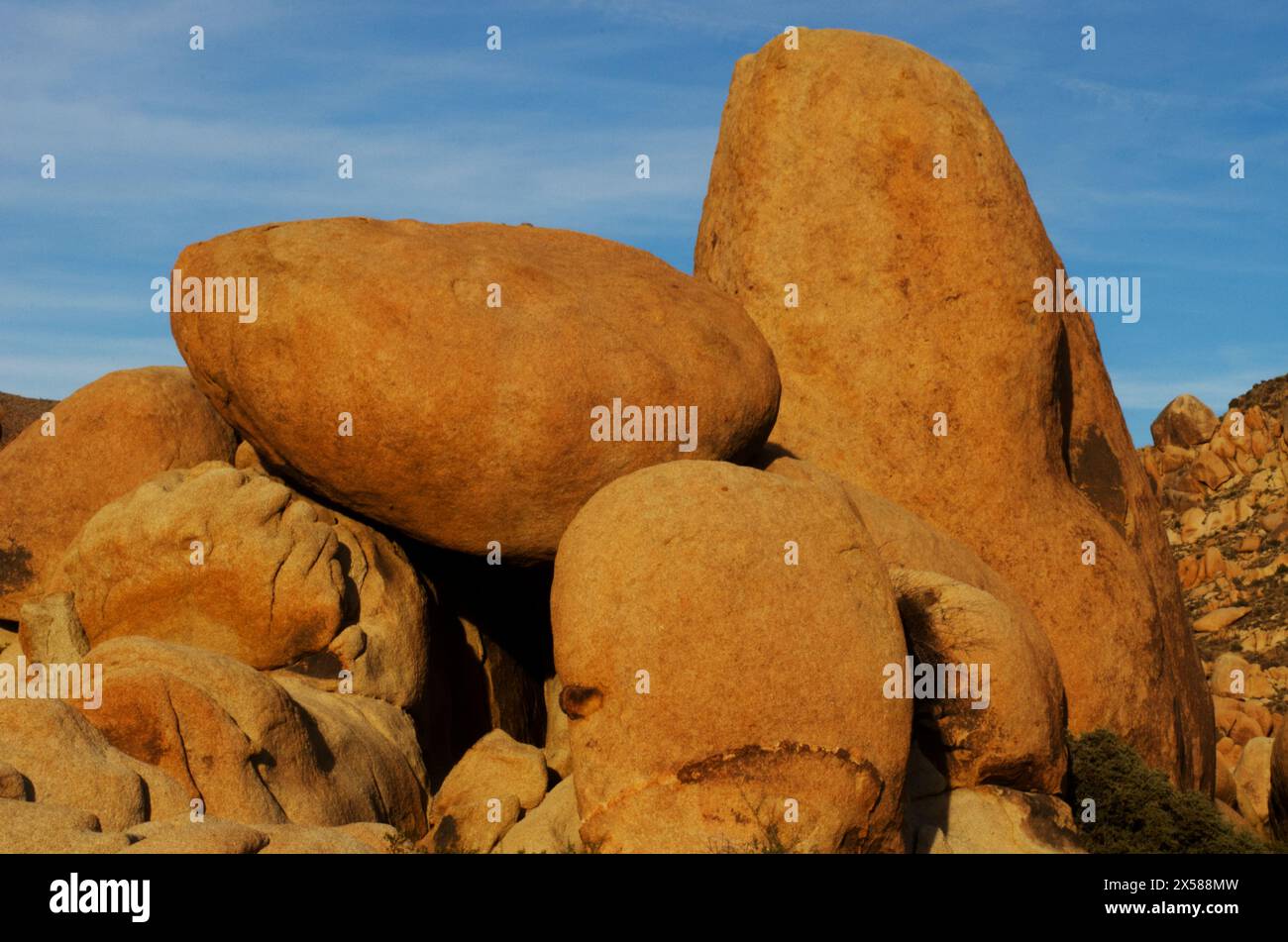 :Landscape of giant sandstone boulders against blue sky & clouds ...