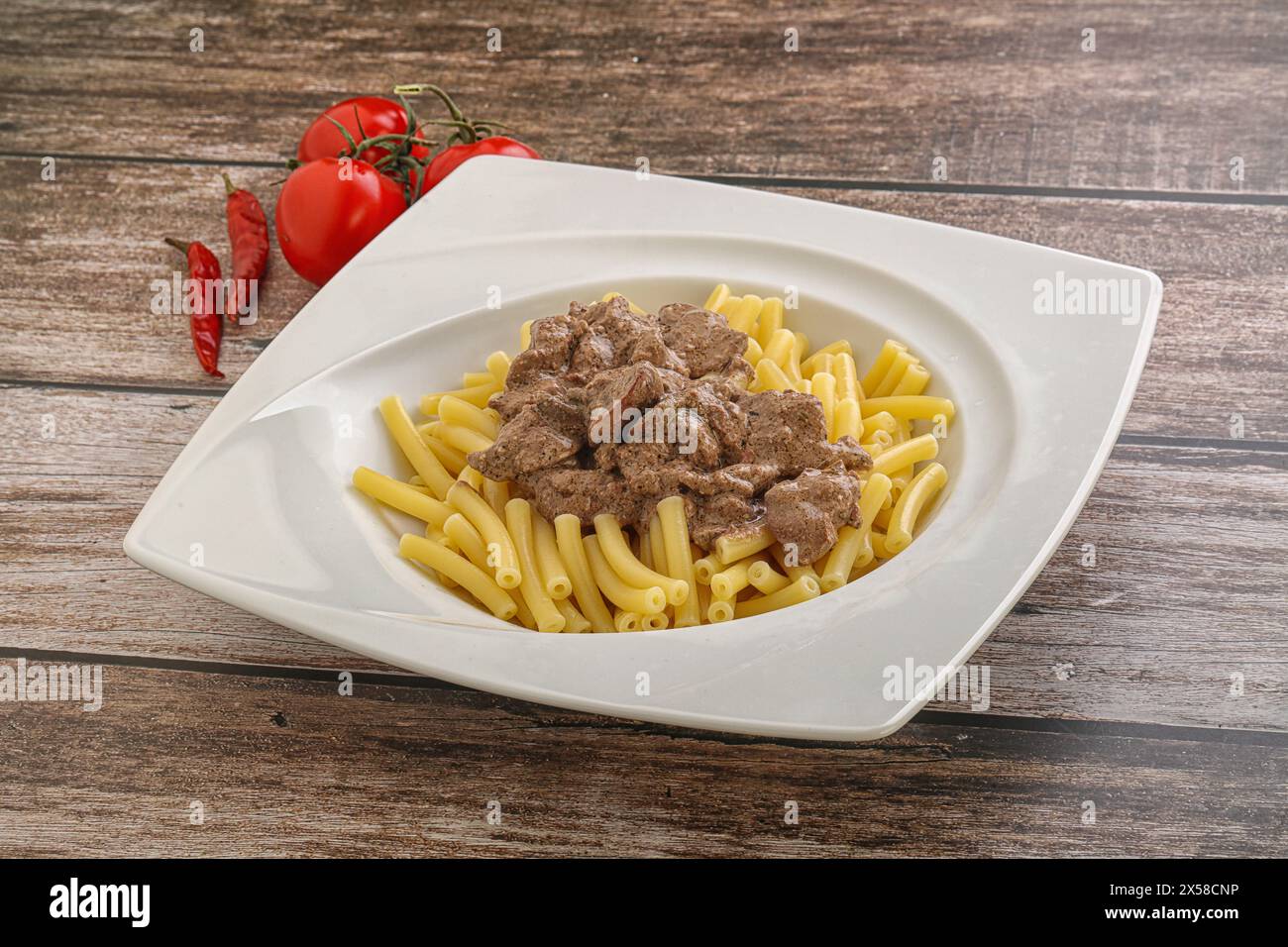 Creamy chicken liver with pasta macaroni Stock Photo - Alamy
