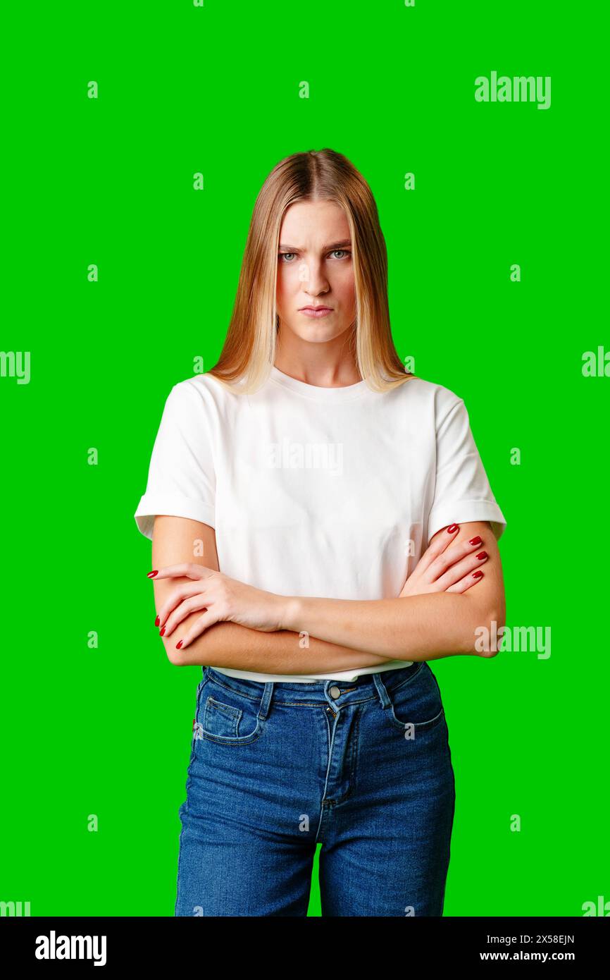 Young Woman With Pursed Lips Expressing Skepticism Against Green Screen ...