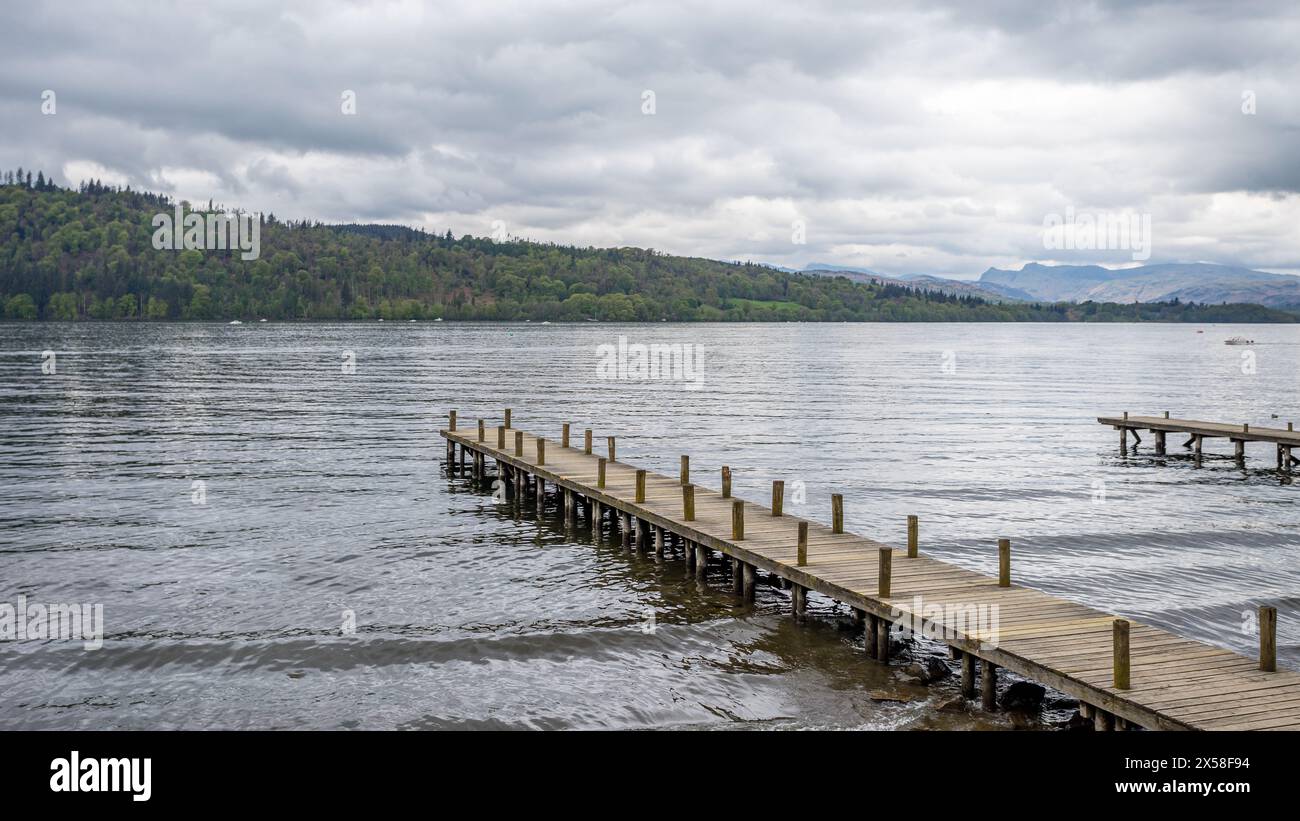 Two wooden jettys side by side on the shoreline of Lake Windermere ...
