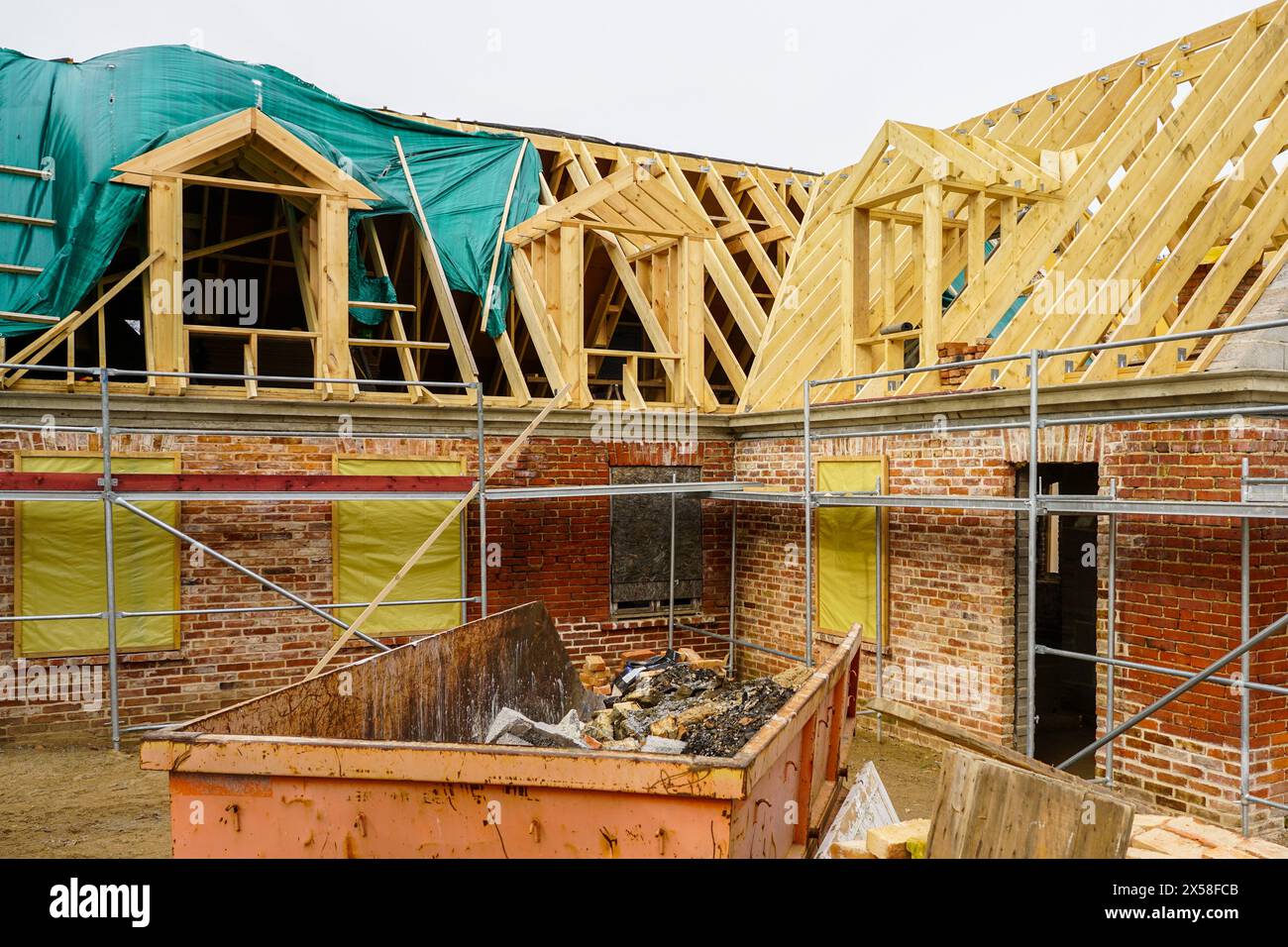 Reconstruction of an old brick house, replacement of wooden roof ...